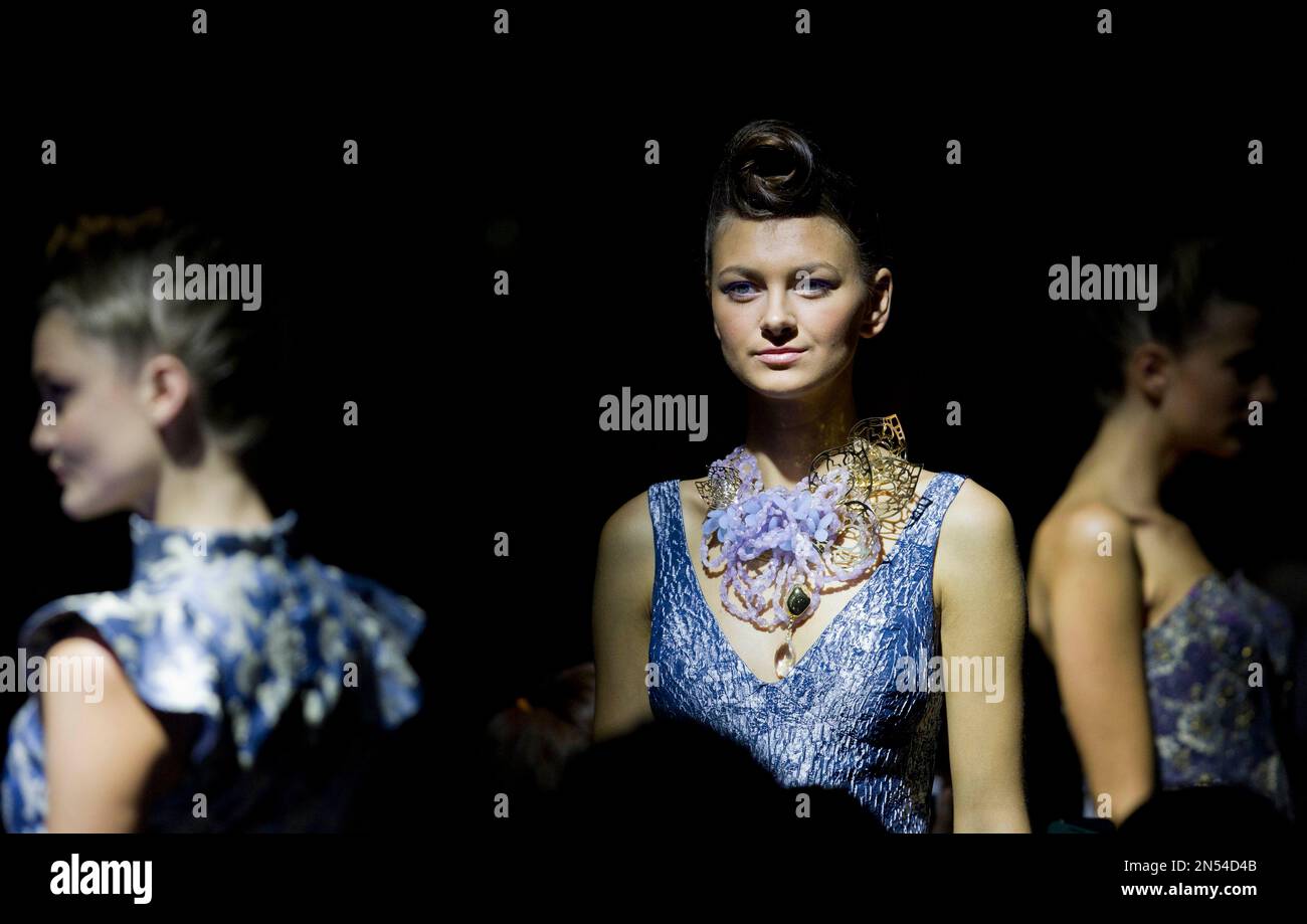 Three models wear a creation by Mexican designer Macario Jimenez at the ...