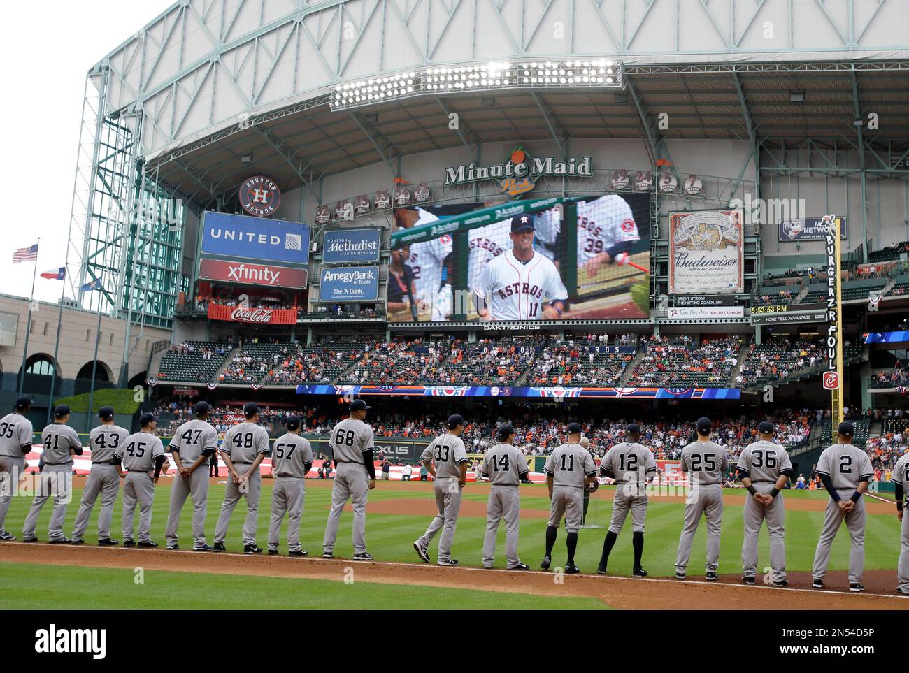 The New York Yankees line up on the field and watch as Houston Astros ...
