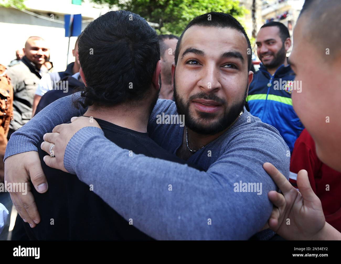 Two Lebanese residents, an Alawite man, left, and a Sunni man, right ...