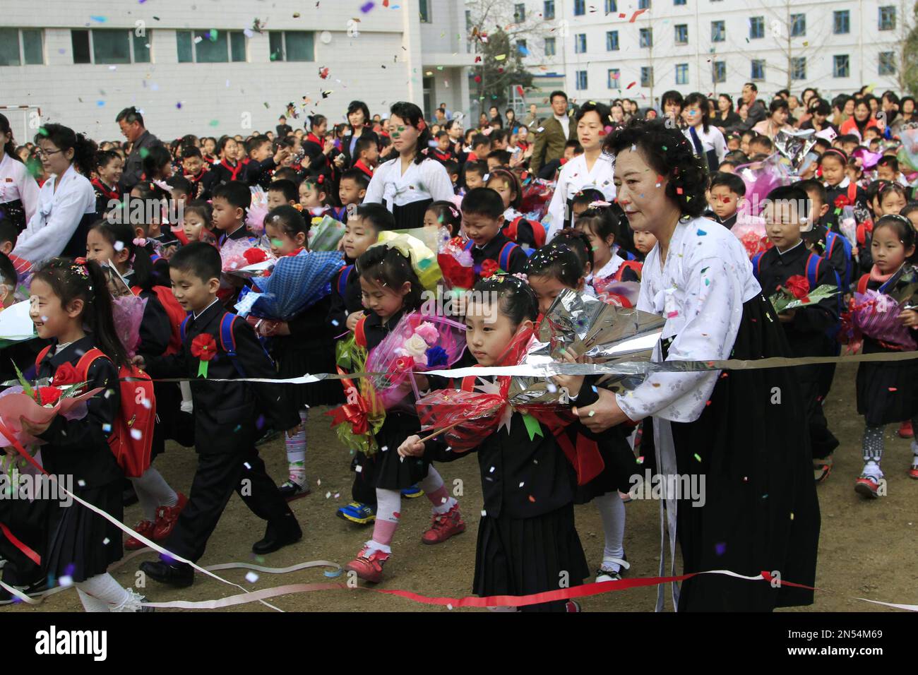 New students enrolled at the Pyongyang Primary School No.4 are showered ...