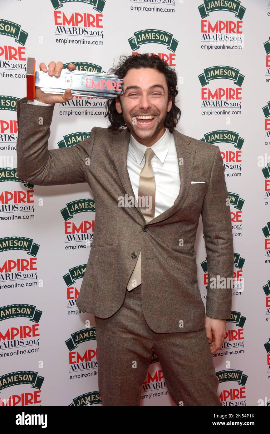 Actor Aidan Turner, winner of the best male newcomer award poses for ...