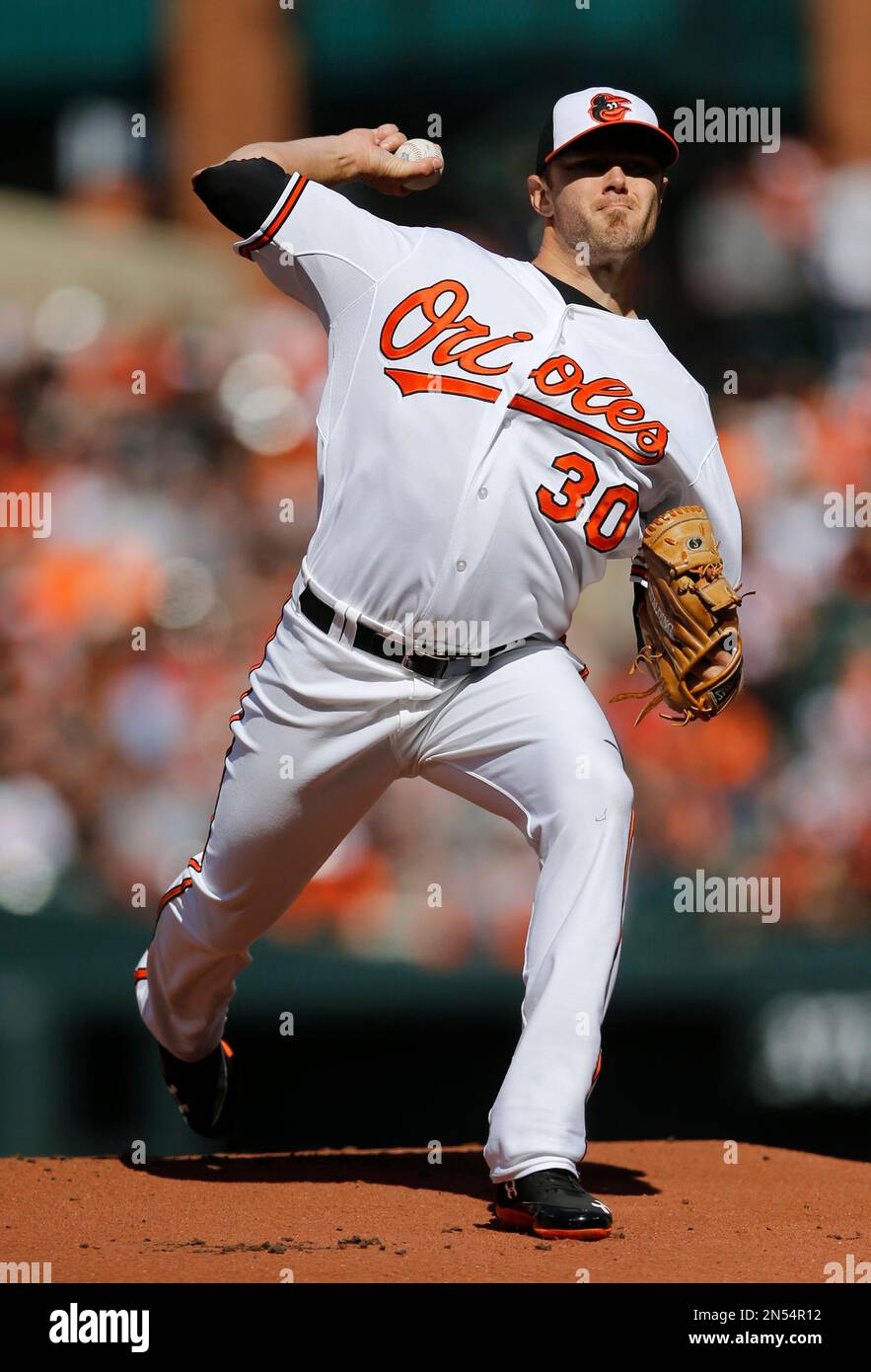 Baltimore Orioles starting pitcher Chris Tillman throws to the Boston ...