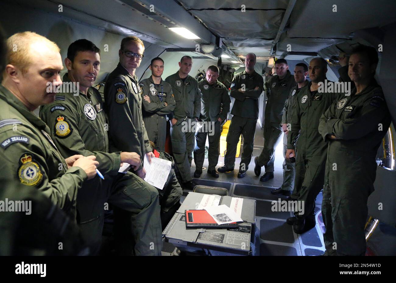 A Royal New Zealand Air Force P-3 Orion crew has a briefing prior to ...