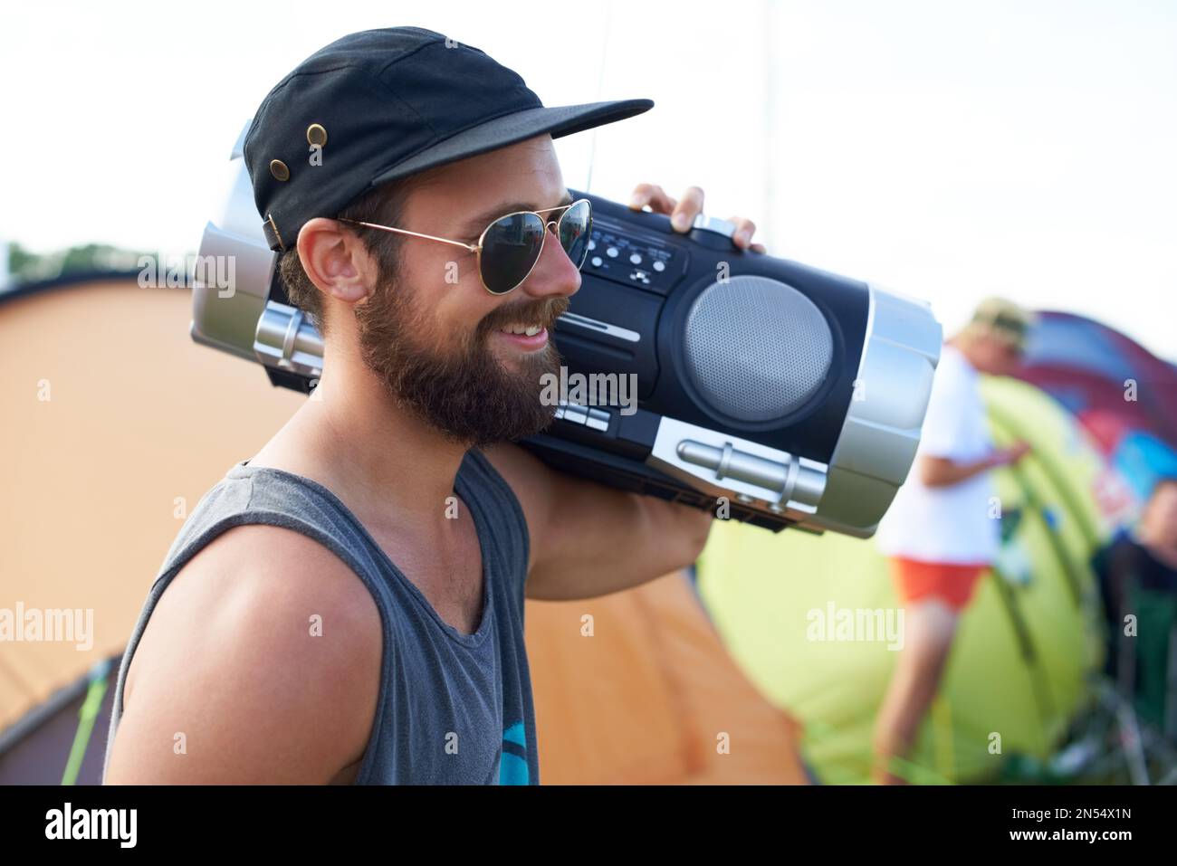 Taking the music with me. a guy carrying a boom-box on his shoulder at ...