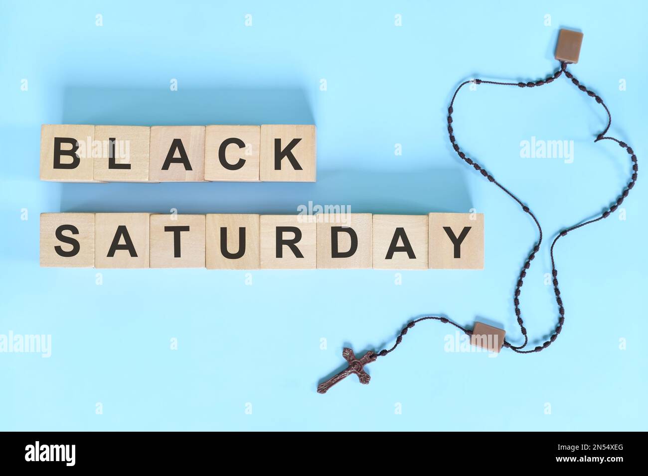 Black Saturday holy week concept. Wooden blocks typography with rosary ...
