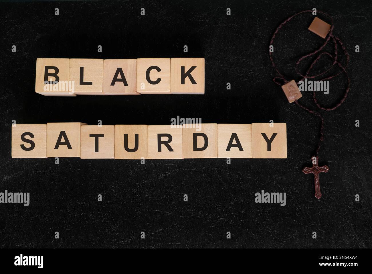 Black Saturday holy week concept. Wooden blocks typography with rosary ...
