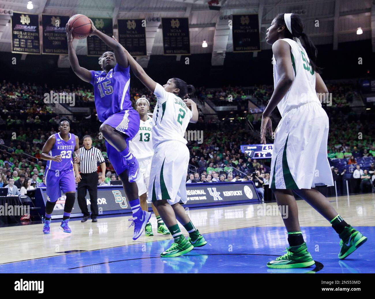 Kentucky guard Linnae Harper (15), left, drives to the basket against ...