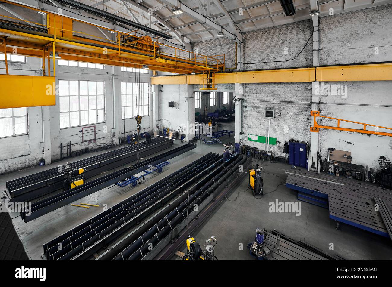 Long steel constructions assembling with welding in workshop Stock ...