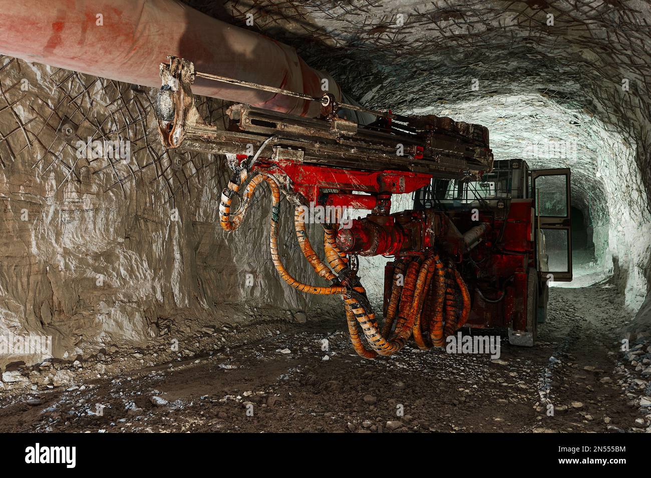 Mining drilling machine works in tunnel of salt quarry Stock Photo - Alamy