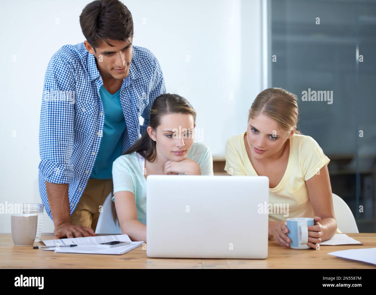 Smiling multicultural colleagues giving hi-res stock photography and ...