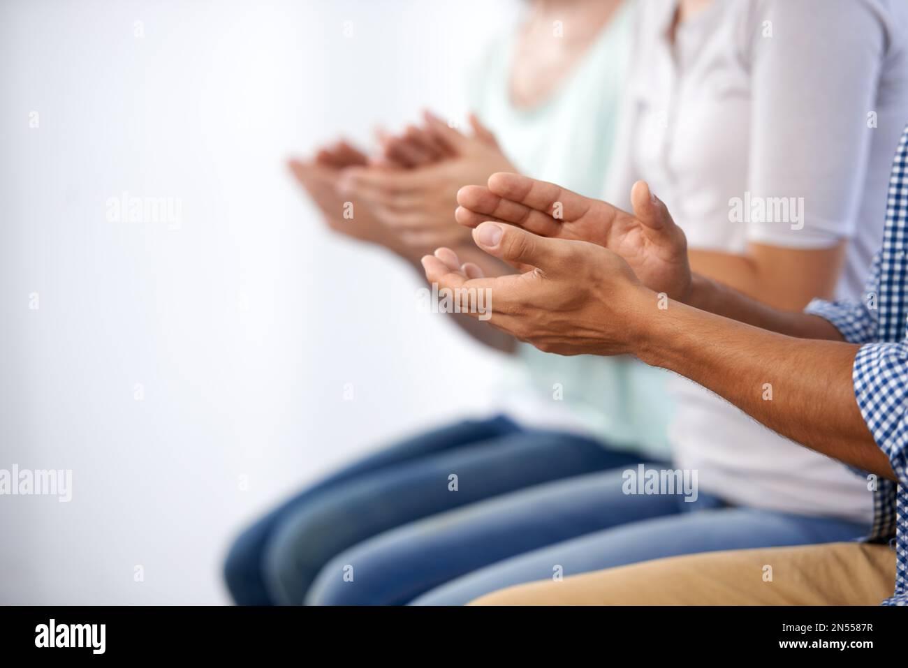 Applause for a colleague. a peoples hands clapping Stock Photo - Alamy