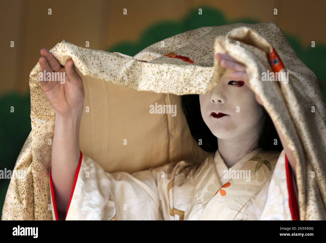 A young boy acting as an old woman performs during a show of an amateur ...