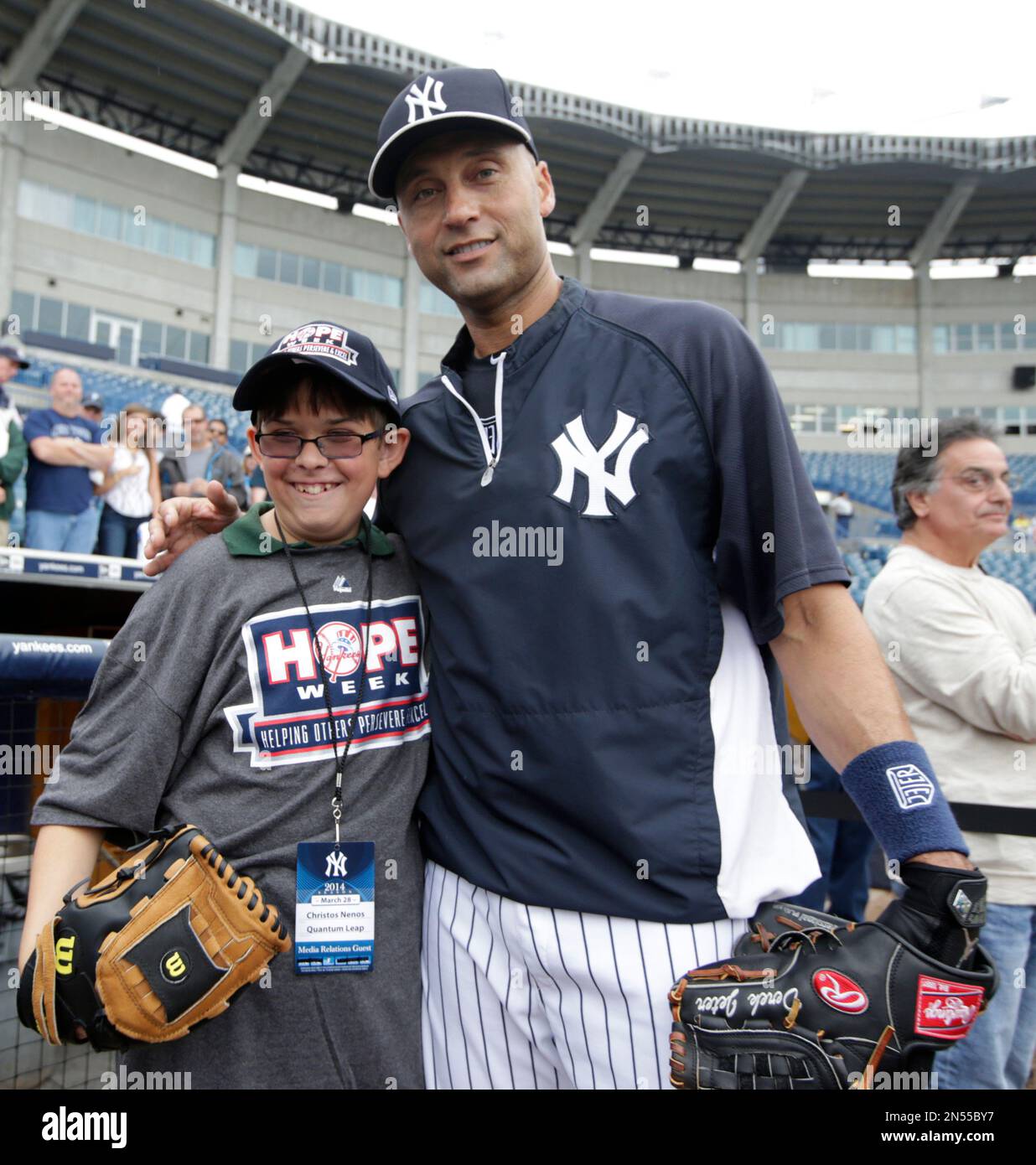New York Yankees shortstop Derek Jeter poses for a photograph with 14 ...