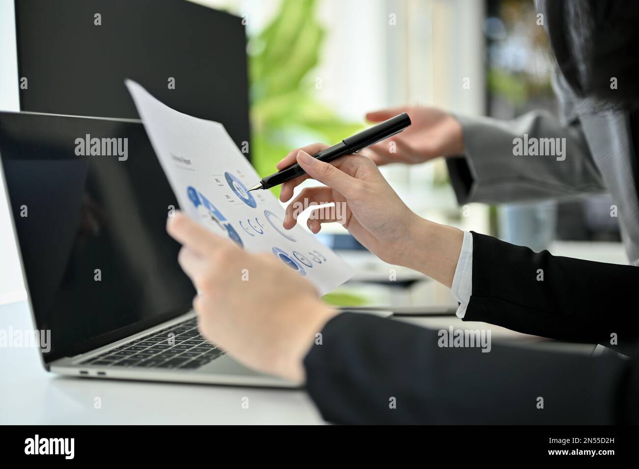 Two women reviewing data hi-res stock photography and images - Alamy