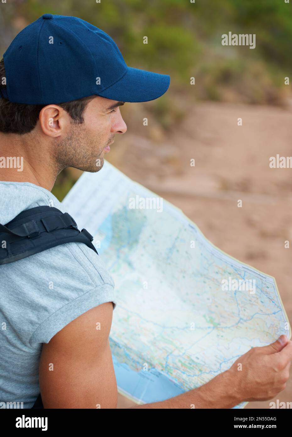 Mapping his journey. Young male hiker holding a map - copyspace Stock ...