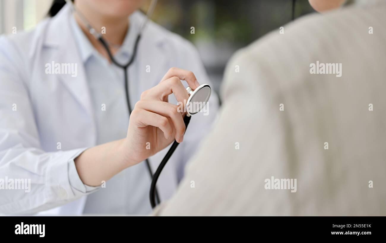Doctor checking patients lungs hi-res stock photography and images - Alamy