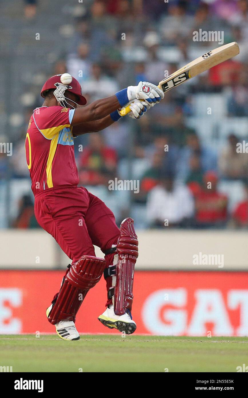The ball hits helmet of West Indies' batsman Dwayne Smith as he ...