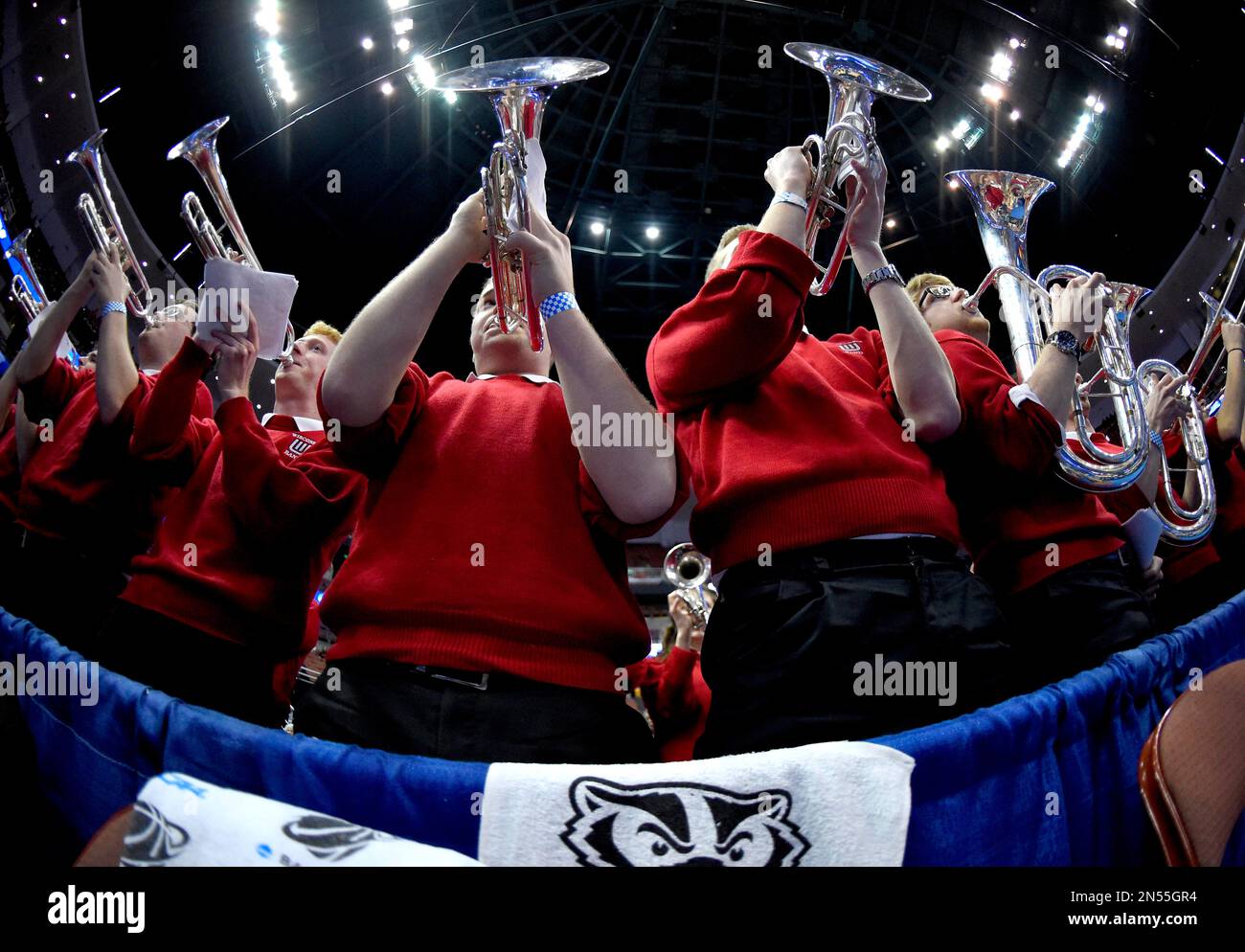 Wisconsin band members play as the teams warm up for a regional ...