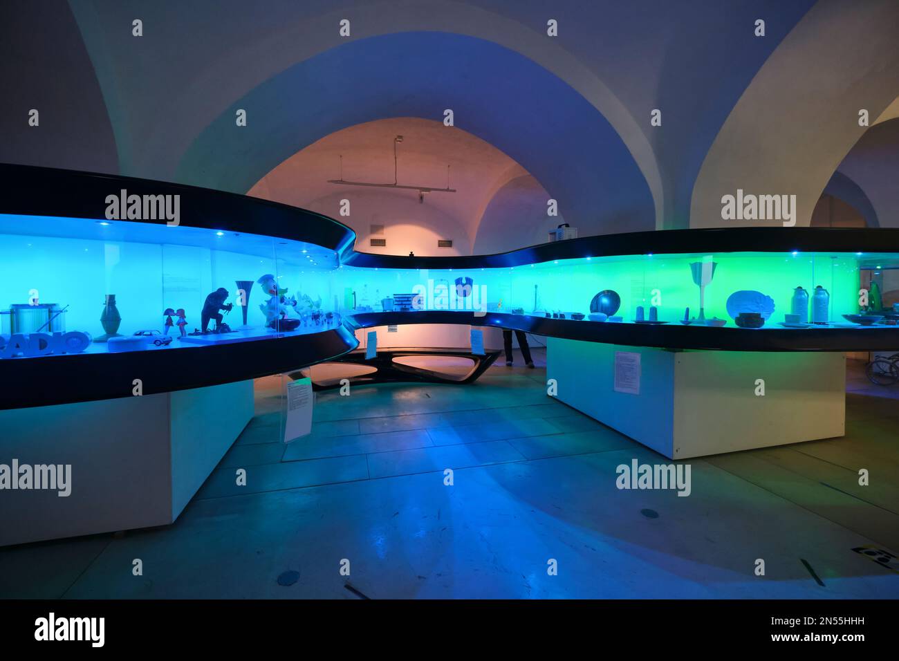 Curved case filled with interesting plastic objects of historical value ...