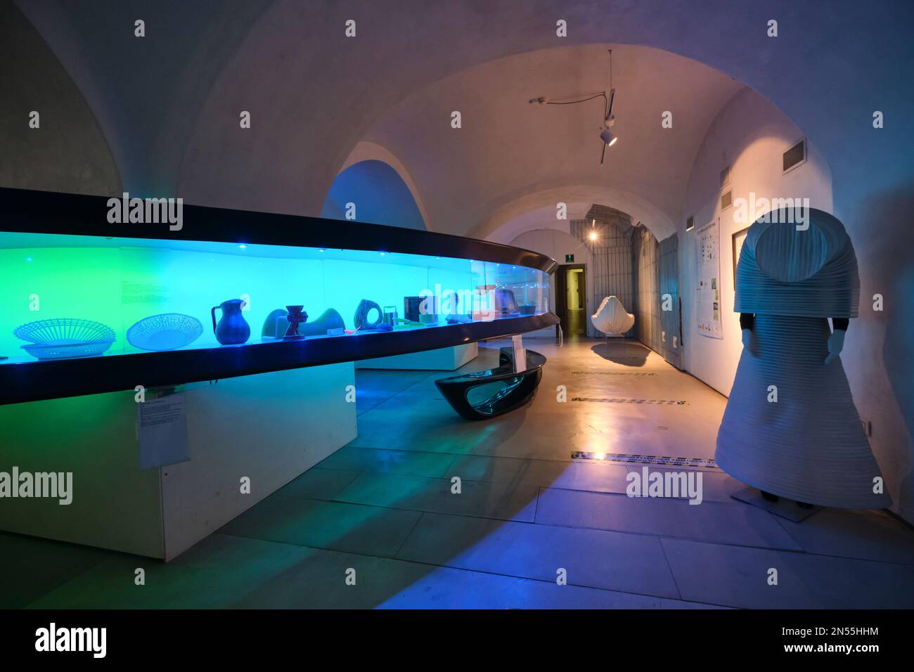 Curved case filled with interesting plastic objects of historical value ...