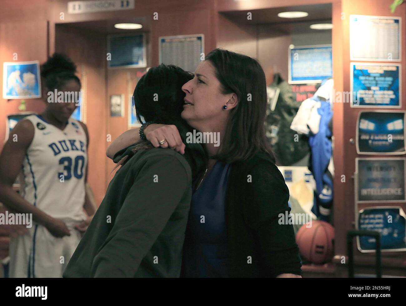 Duke head women's basketball coach Joanne P. McCallie consoles one of ...