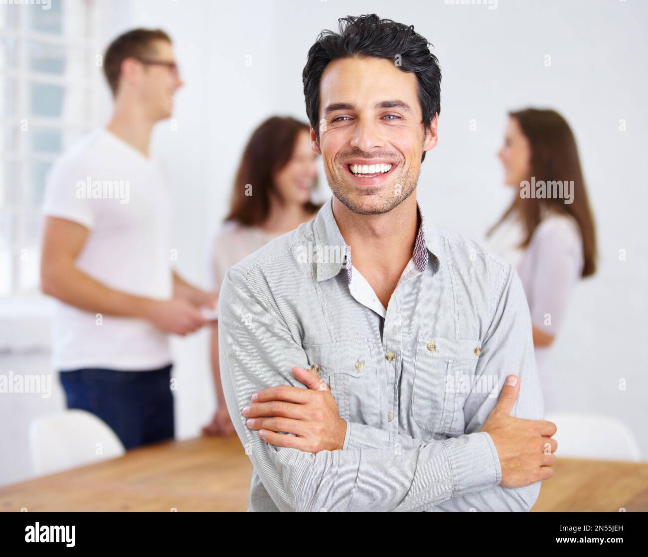 Success is my teams motto. Portrait of a happy-looking young business ...