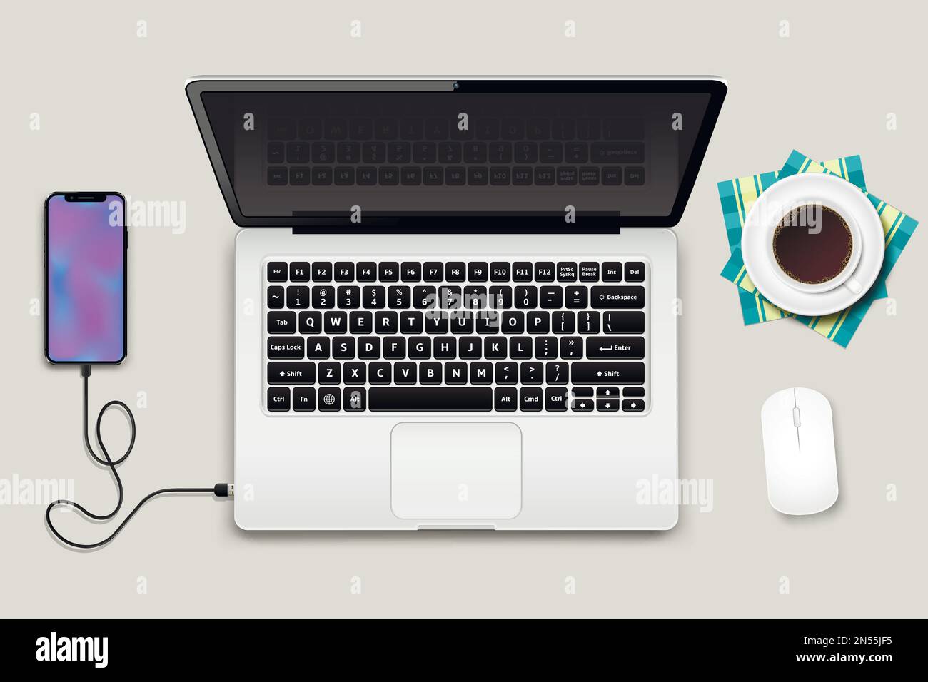 Laptop with phone connected to wire and cup of coffee on a table Stock ...