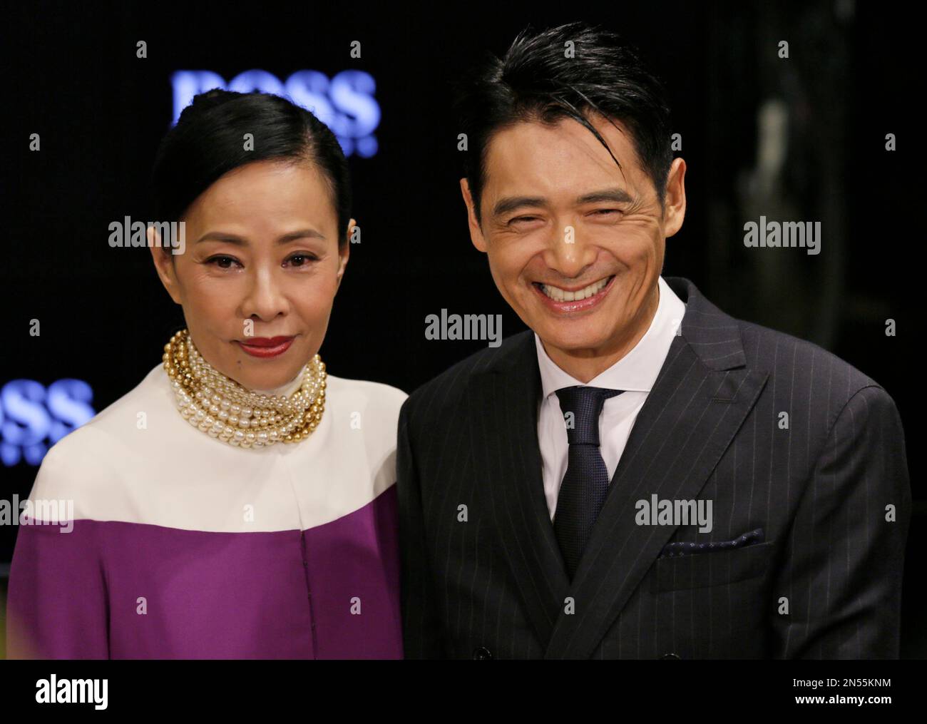 Hong Kong Actor Chow Yun Fat And His Wife Jasmine Tan Pose For Photographers During The Opening
