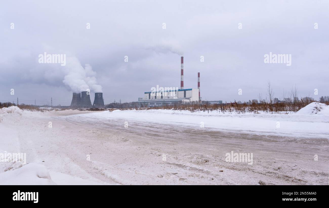A heat and power station with pipes and boilers works at the end of the ...