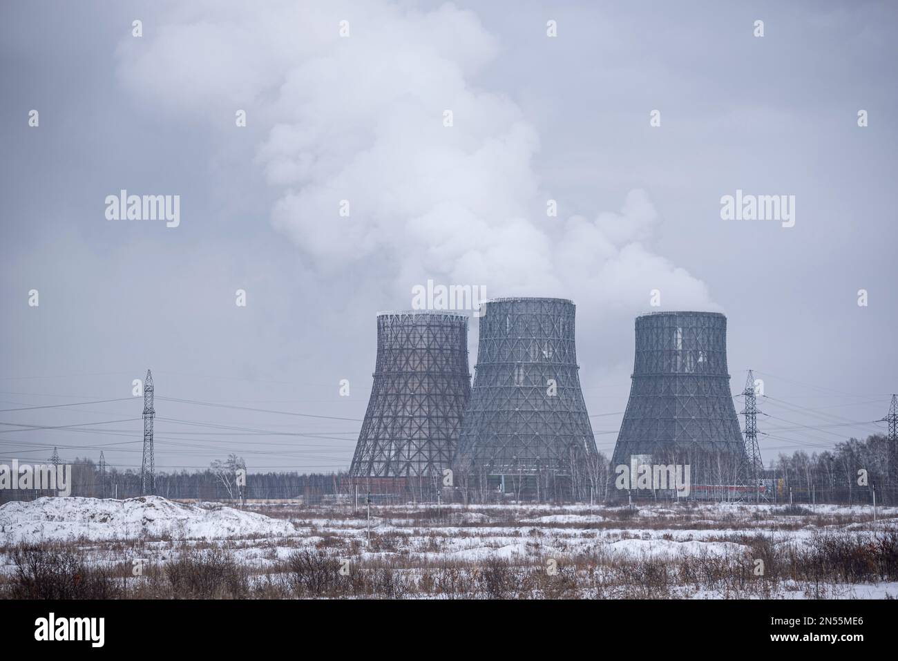 Large boilers of a powerful coal-fired power station smoke into the sky ...