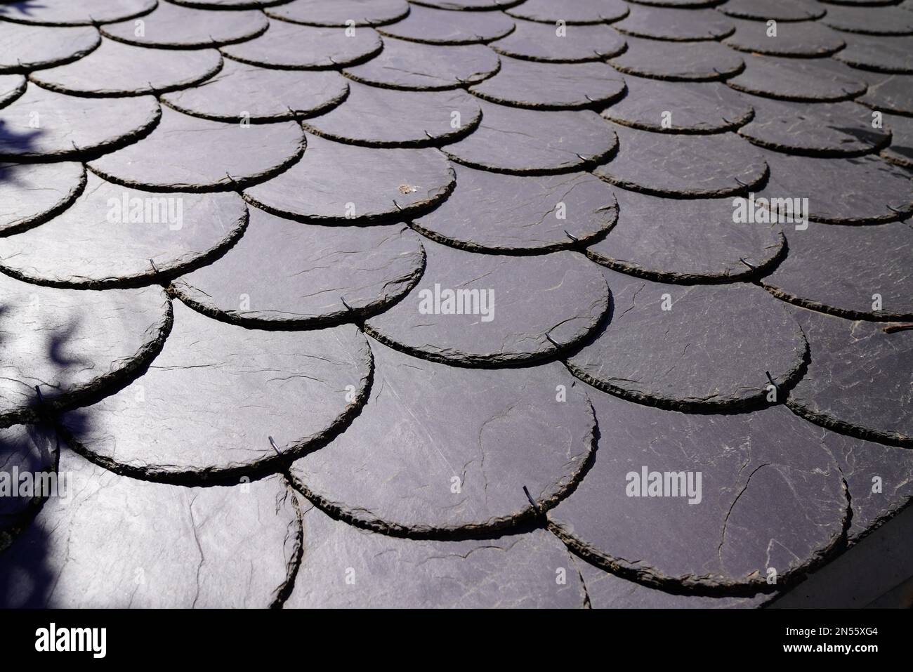 rounded tile stone wall background of house roof wallpaper Stock Photo ...