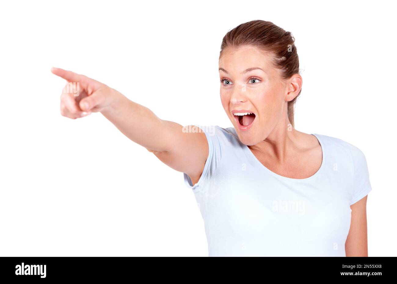 Digital touchscreen. An excited young woman pointing at something while ...