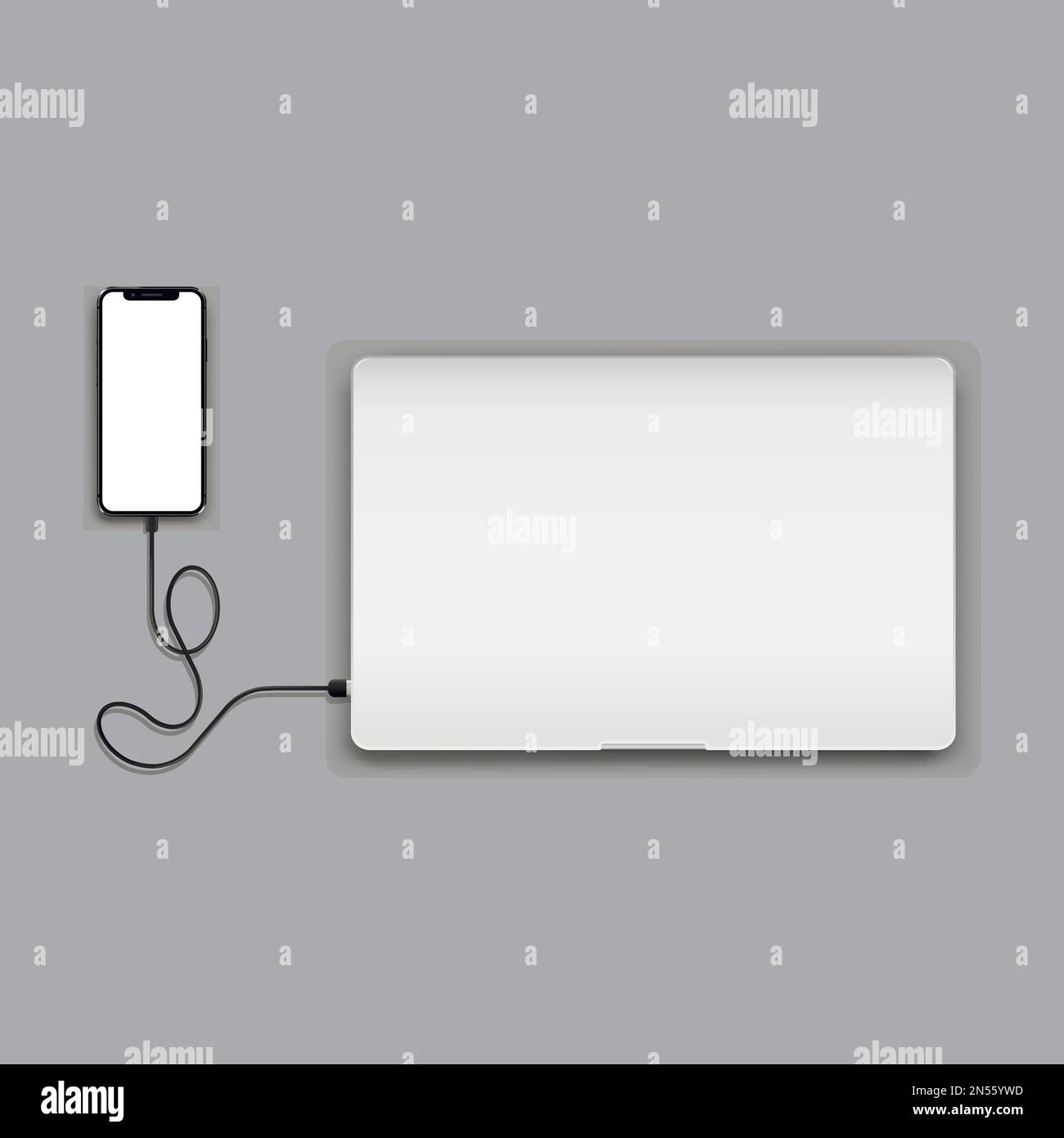 Smartphone with wireless charger connected to closed laptop Stock ...