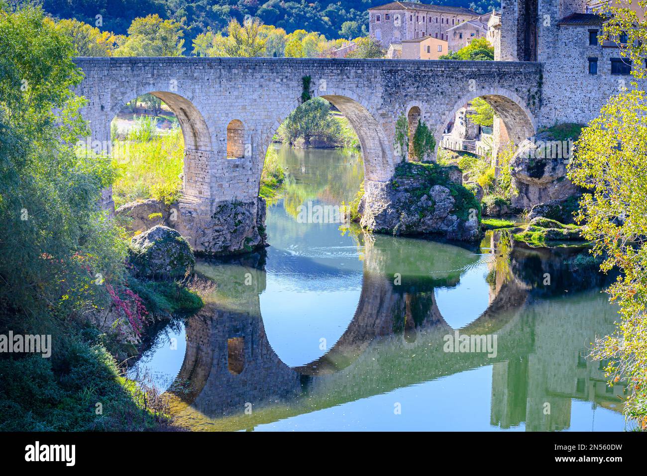 Famous medieval bridge over the river Fluvia in the medieval village de ...