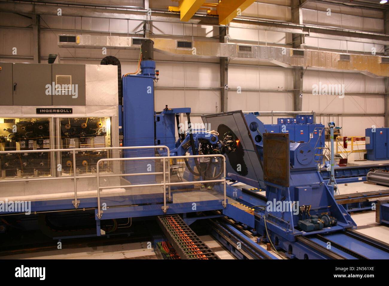 A machine uses infrared frequencies to warm a high-tech composite ...