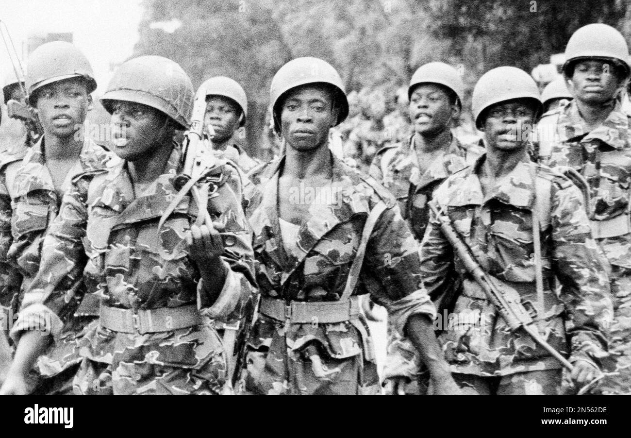 Congolese paratroops in camouflage uniforms return to camp after field ...