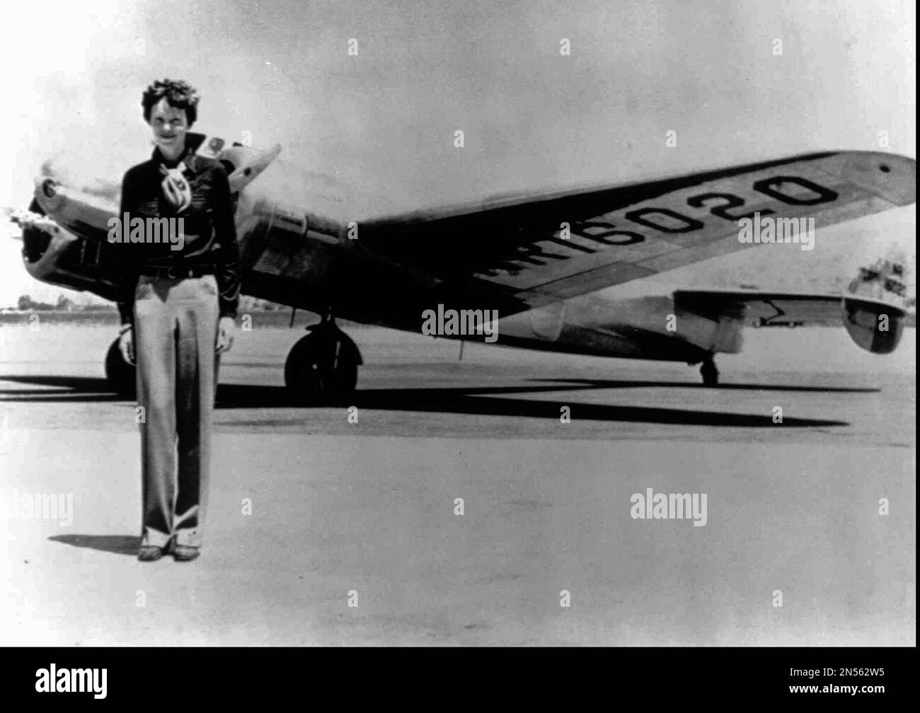 FILE - In this undated file photo, Amelia Earhart stands next to a ...