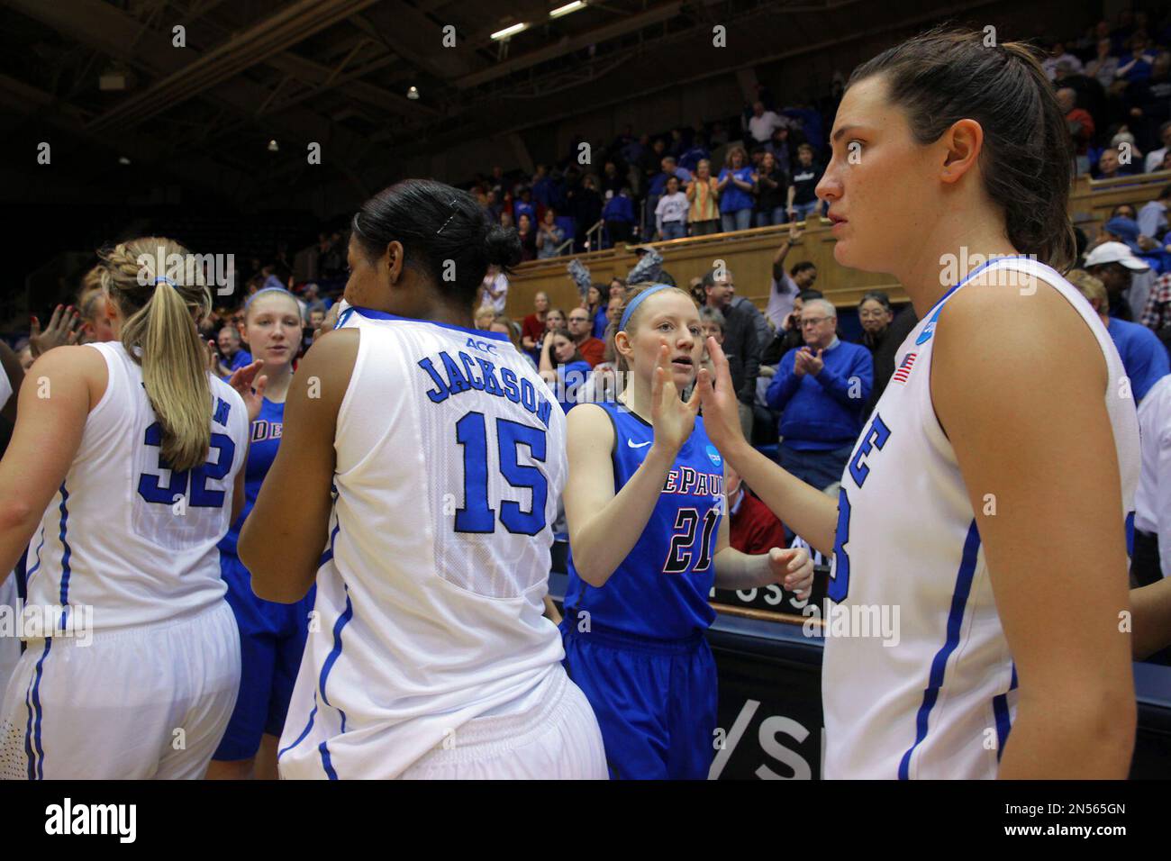 Duke's Haley Peters, right, looks away while high-fiving DePaul's Megan ...