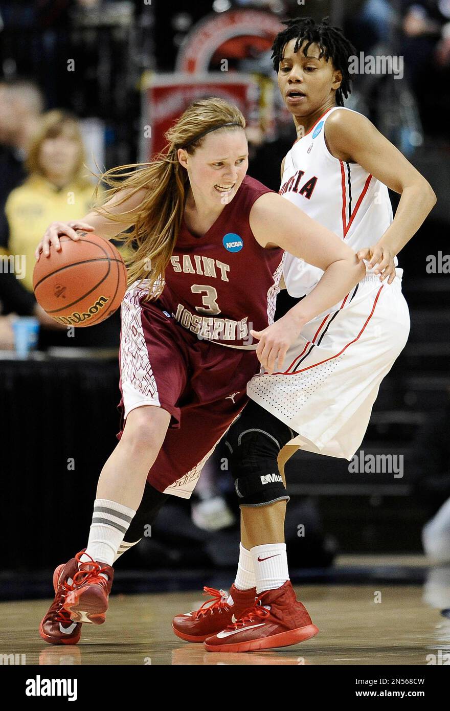 Saint Joseph's Erin Shields, left, drives around Georgia's Tiaria ...