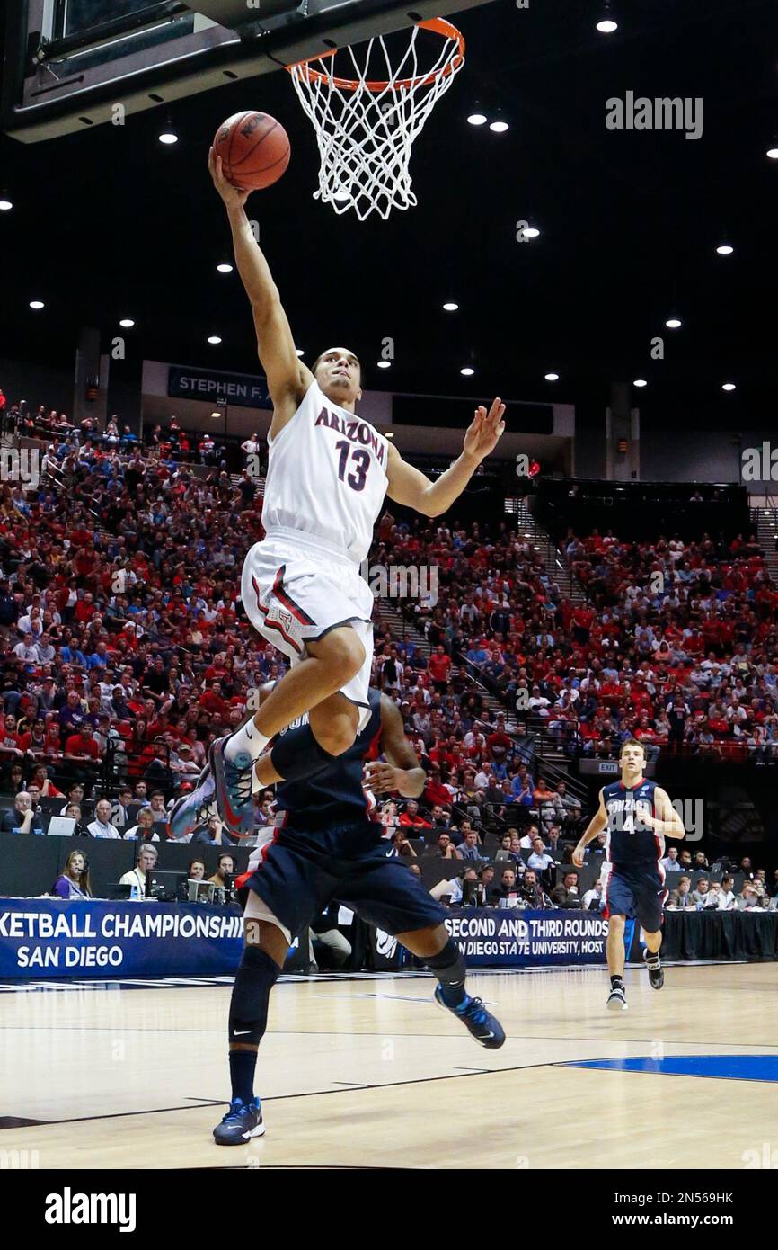 Arizona guard Nick Johnson, above, shoots above Gonzaga guard Gary Bell ...