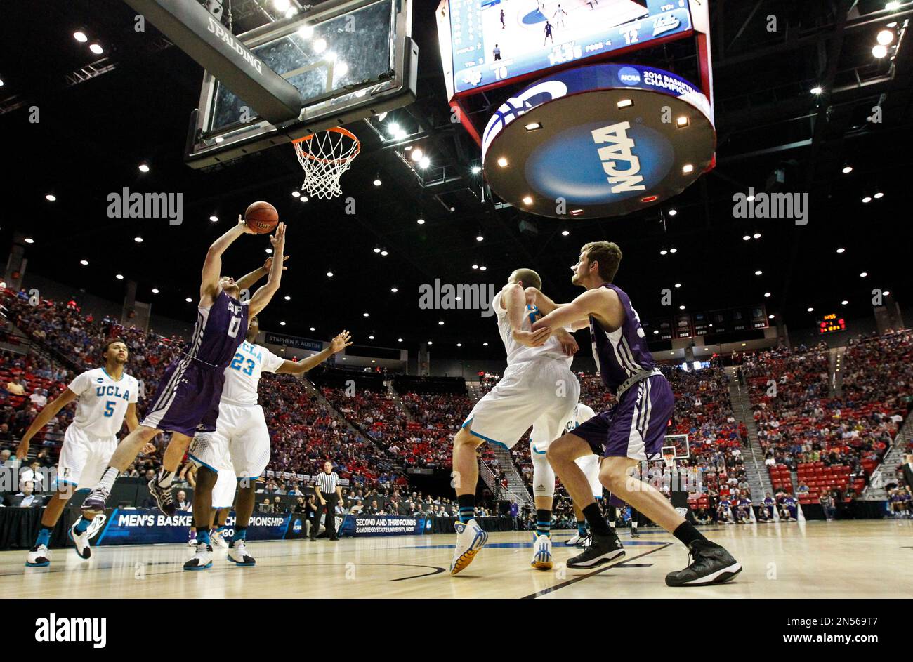 Stephen F. Austin guard Thomas Walkup goes up for a shot against UCLA ...