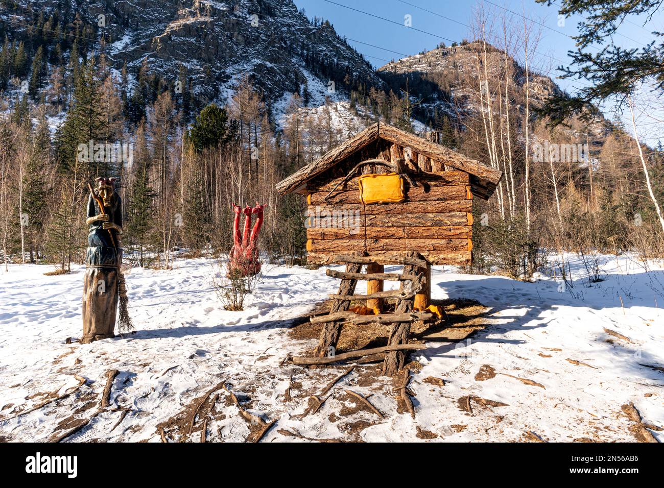 An old Russian hut on chicken legs and a statue of Baba Yaga. Famous ...