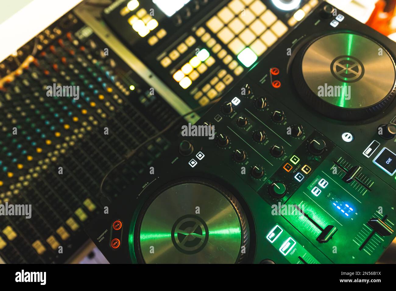 DJ professional music console with knobs and sliders, home studio setup ...