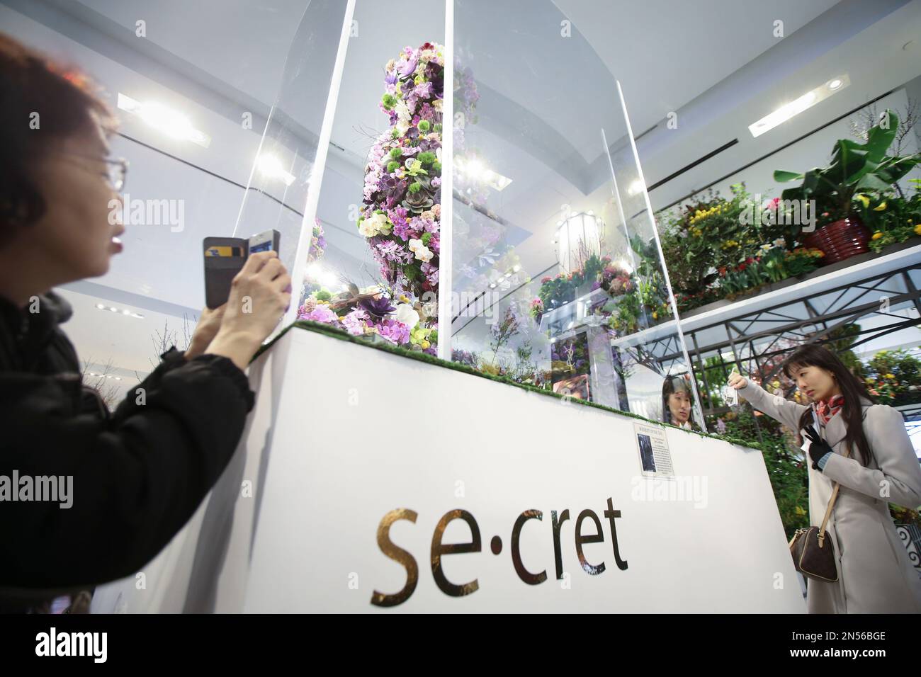 Shoppers visit the bouquet of the day in the aisles of the Macy's ...
