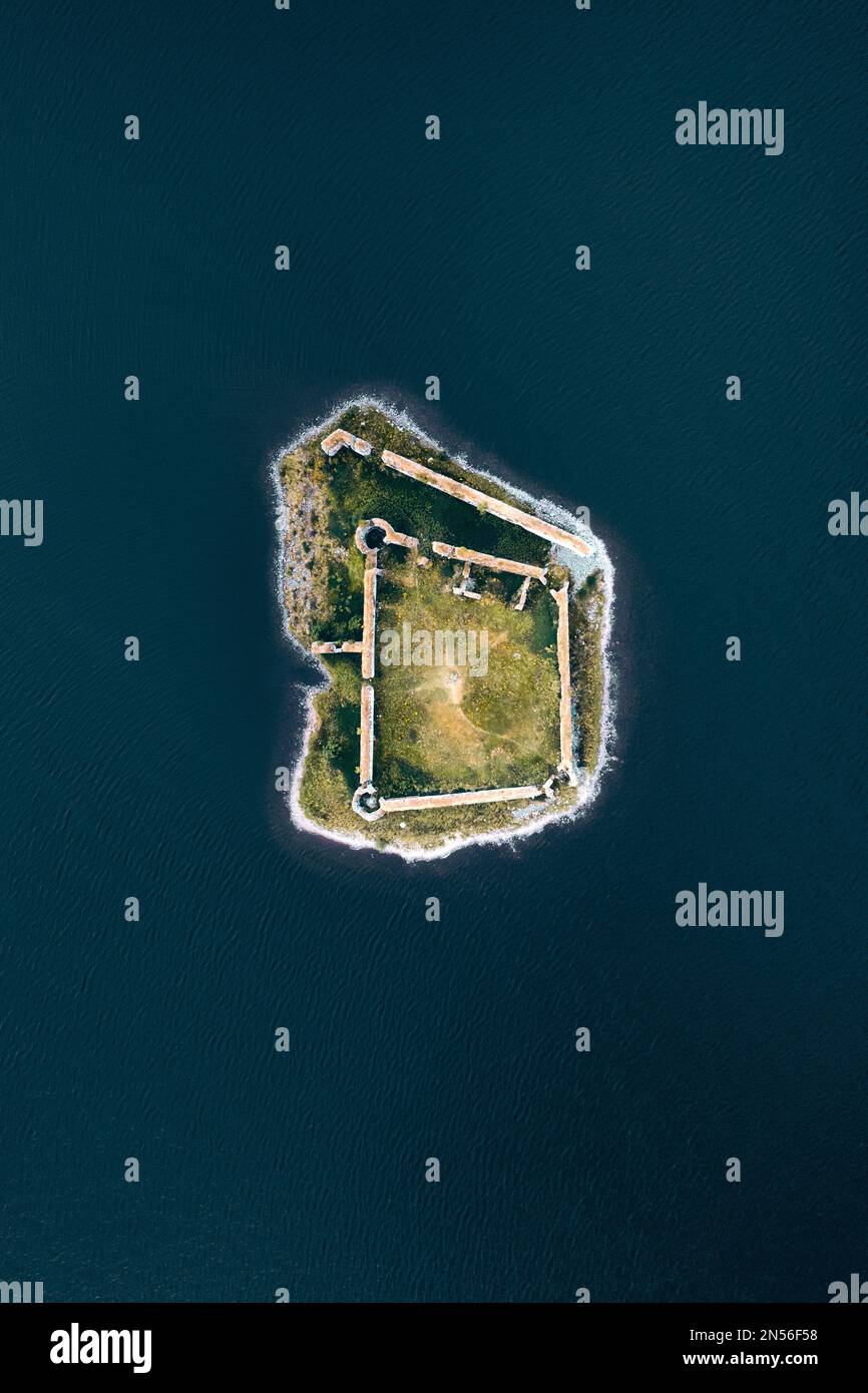 A drone view of the scenic Lochindorb Castle on an island within a lake ...