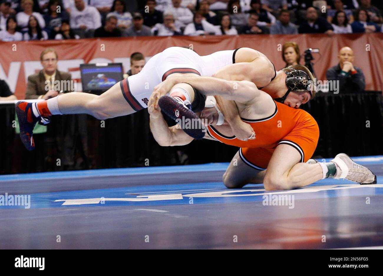 Oklahoma's Andrew Howe, top, and Oklahoma State's Chris Perry, bottom ...