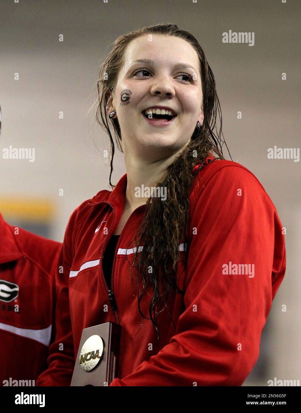 Georgia's Britta MacLean reacts after receiving her trophy for winning ...