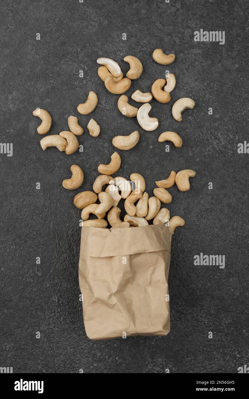 paper bag filled with healthy raw cashew nuts. Resolution and high ...
