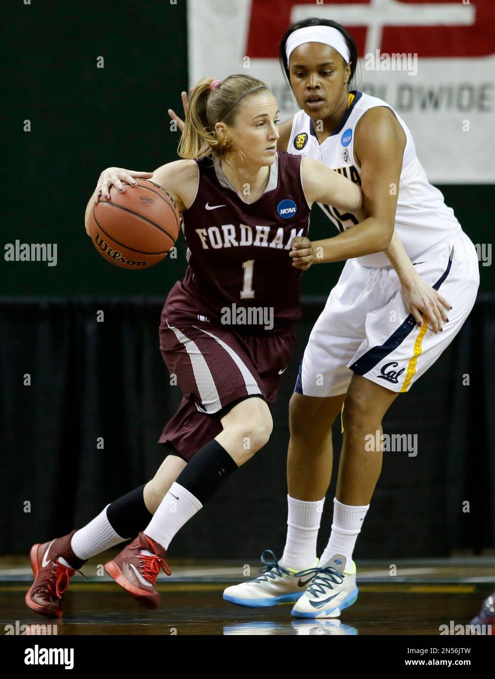 Fordham's Erin Rooney (1) drives against California's Brittany Boyd ...
