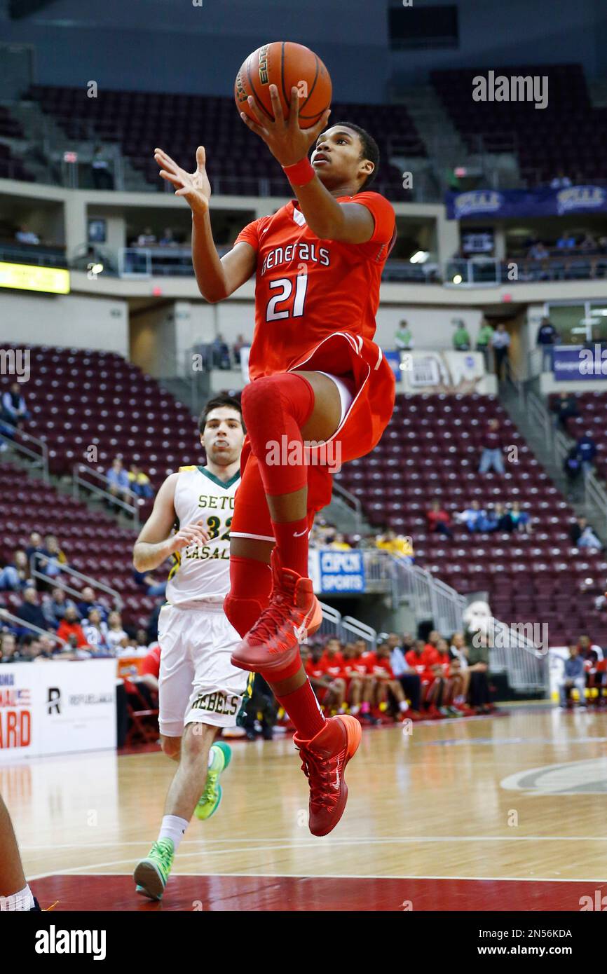 Constitution's Ahmad Gilbert shoots as Seton LaSalle's Ryan Norkus ...